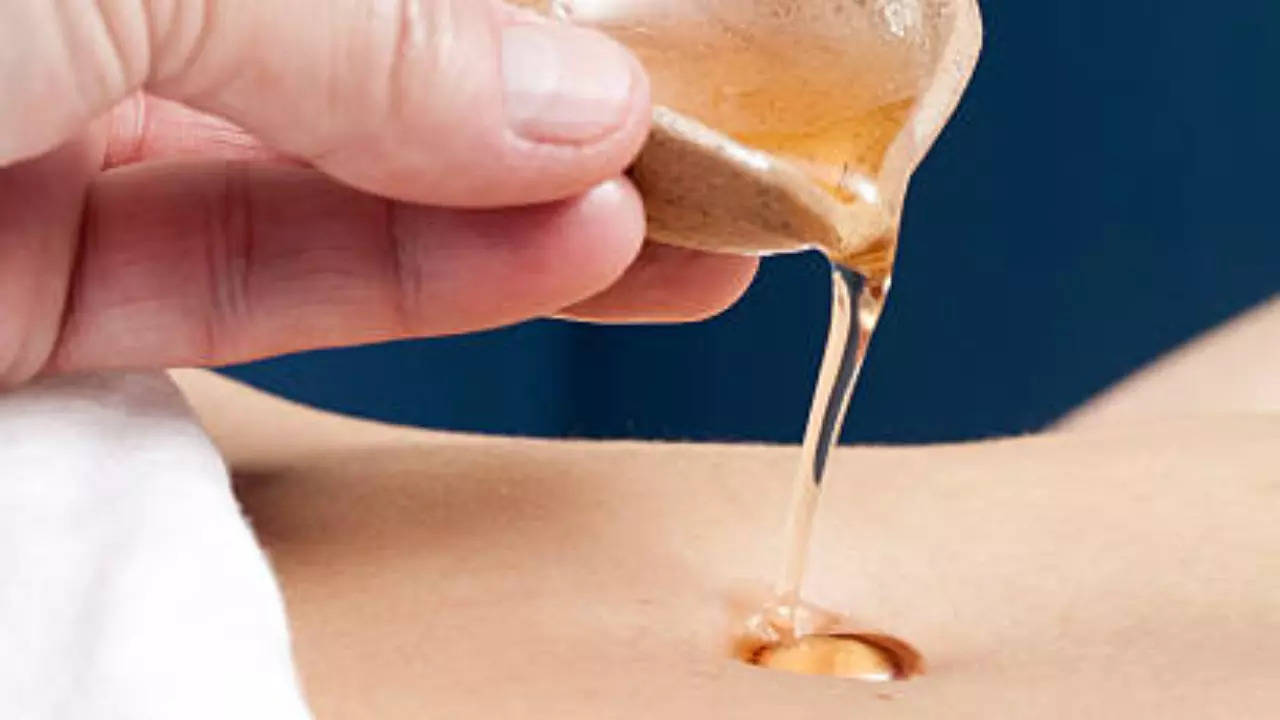 Benefits of applying Ghee on the navel before taking a bath
