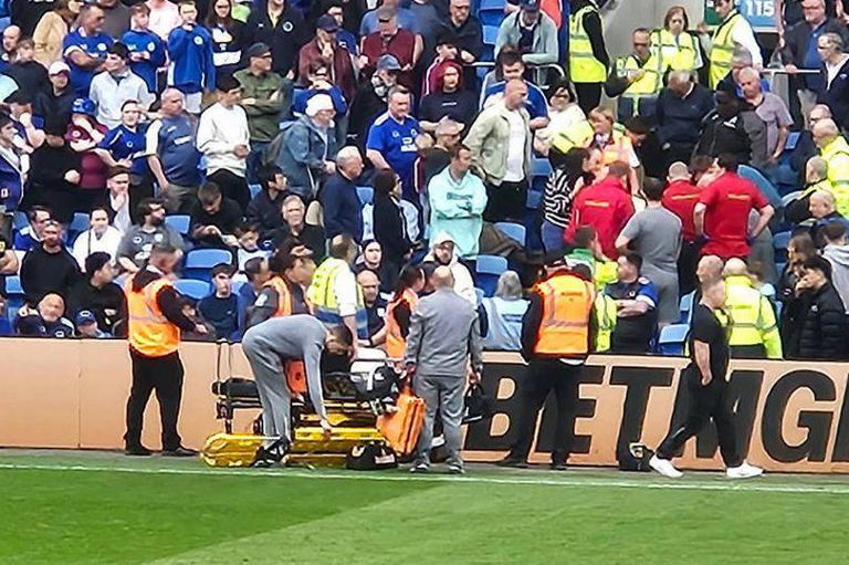 Crucial football match in Wales stopped as fans frantically call for help