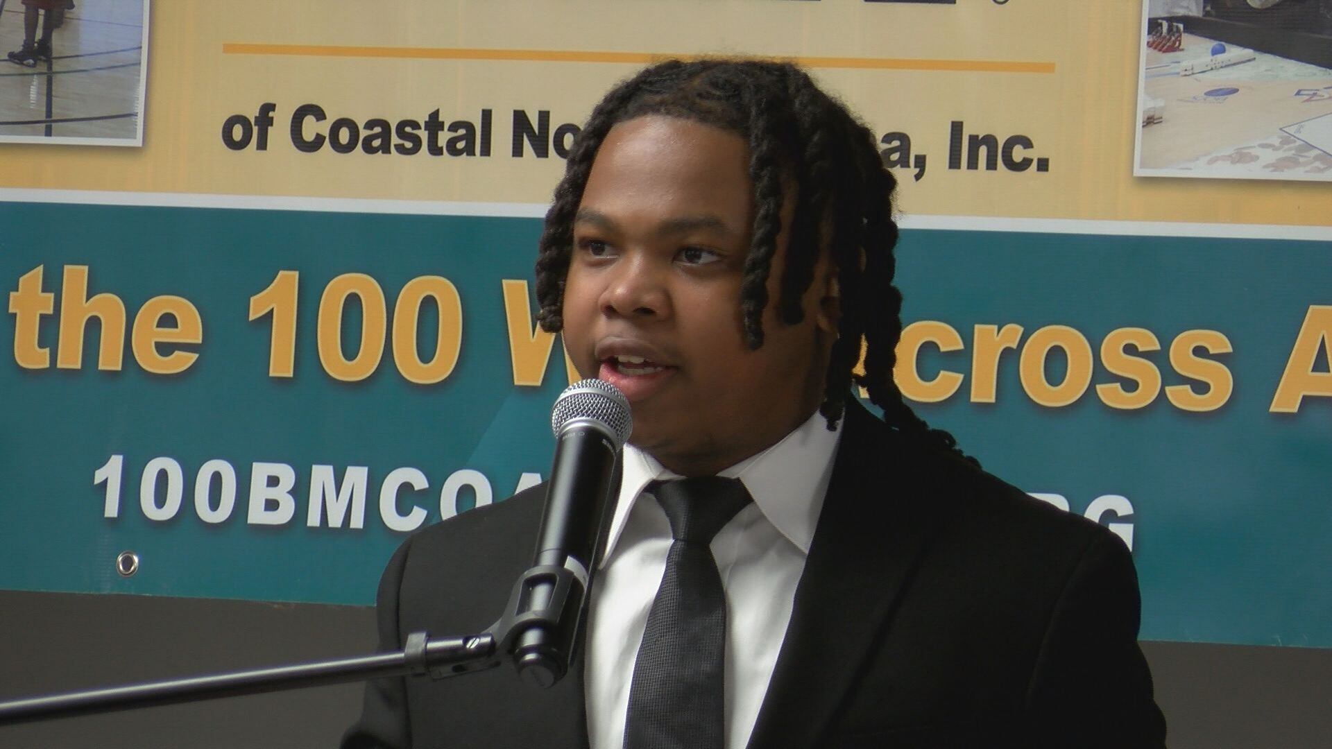 100 Black Men of Coastal NC helps presents youth with scholarships