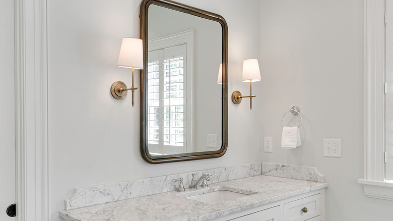 Why Your Bathroom Mirror Has Black Spots (And How To Prevent Them)