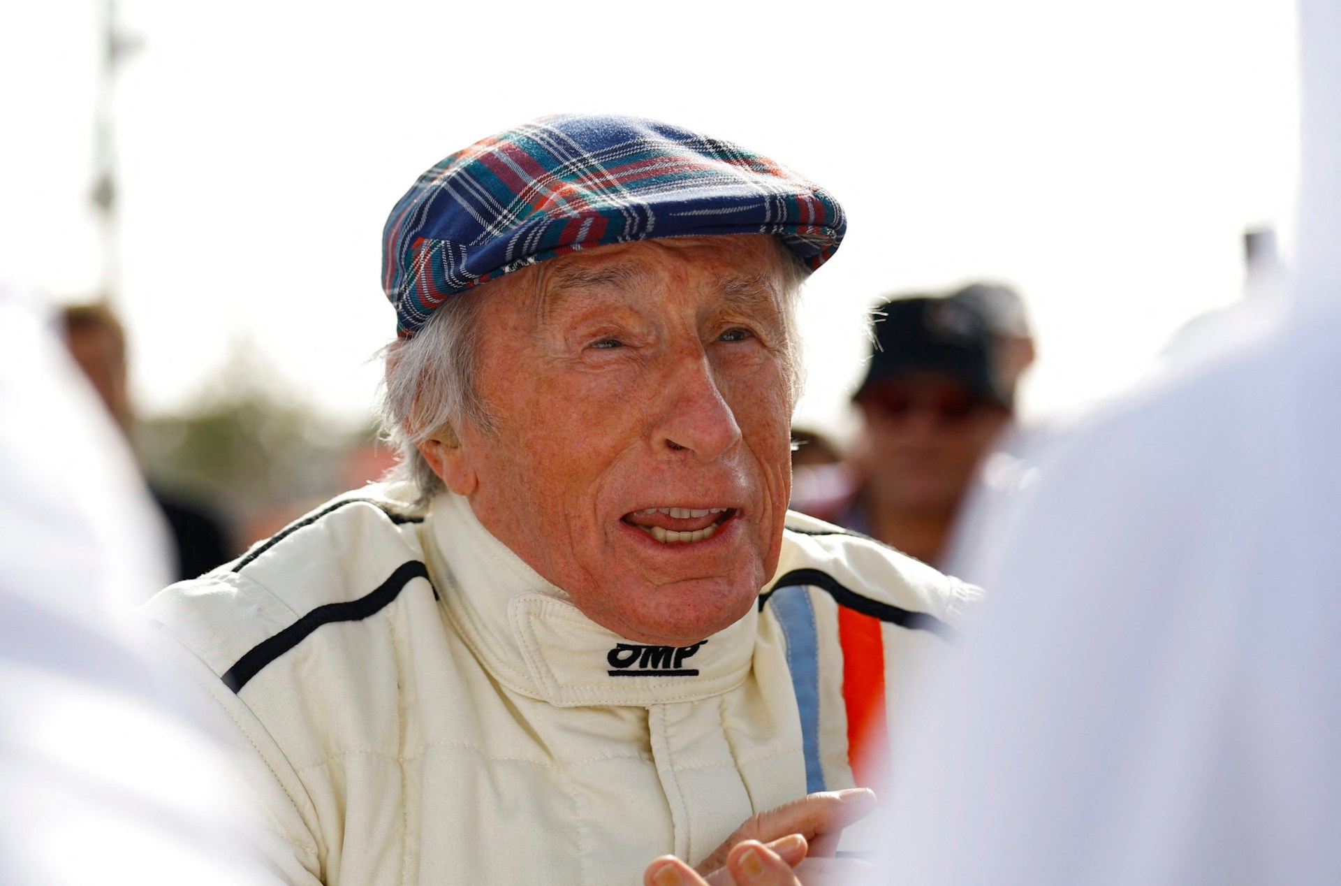 Michael Schumacher's wife helps him autograph Jackie Stewart helmet for ...