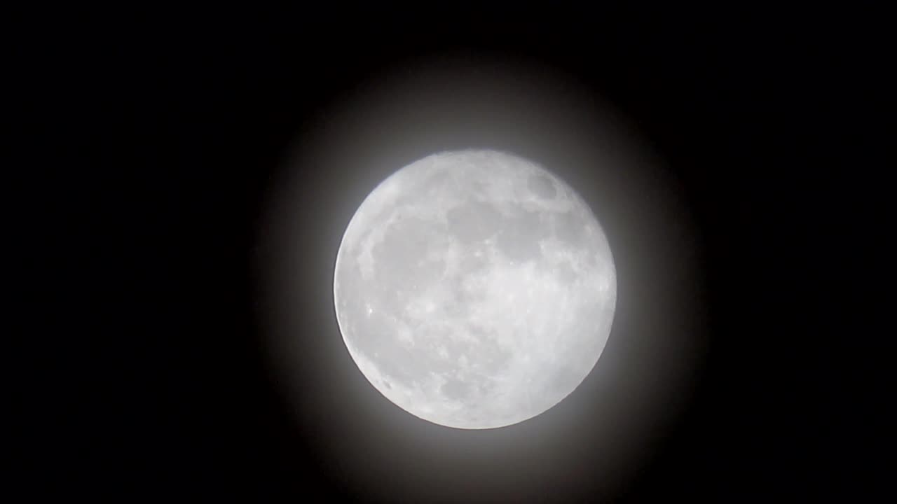 The April Full Moon, known as the Pink Moon high in the sky over East ...