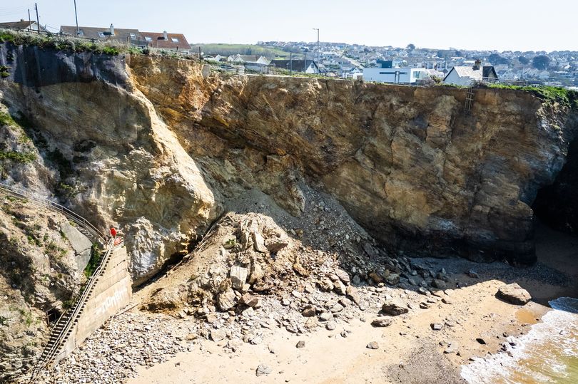 Massive cliff collapses as 2,000 tonnes of rock plummet next to luxury ...