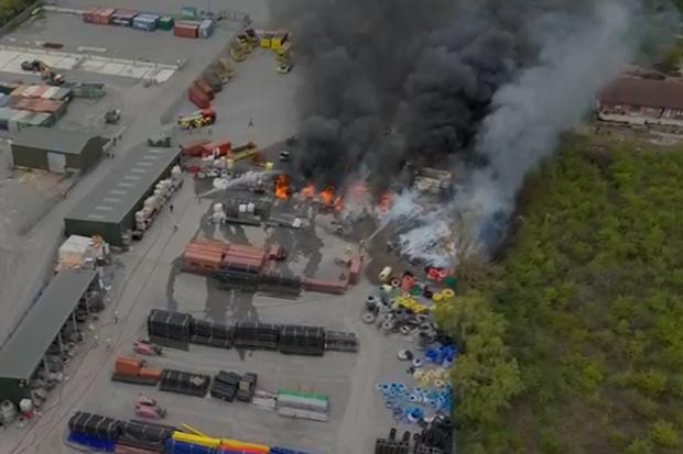 WATCH: Drone footage shows flames and black smoke as crews tackle huge ...
