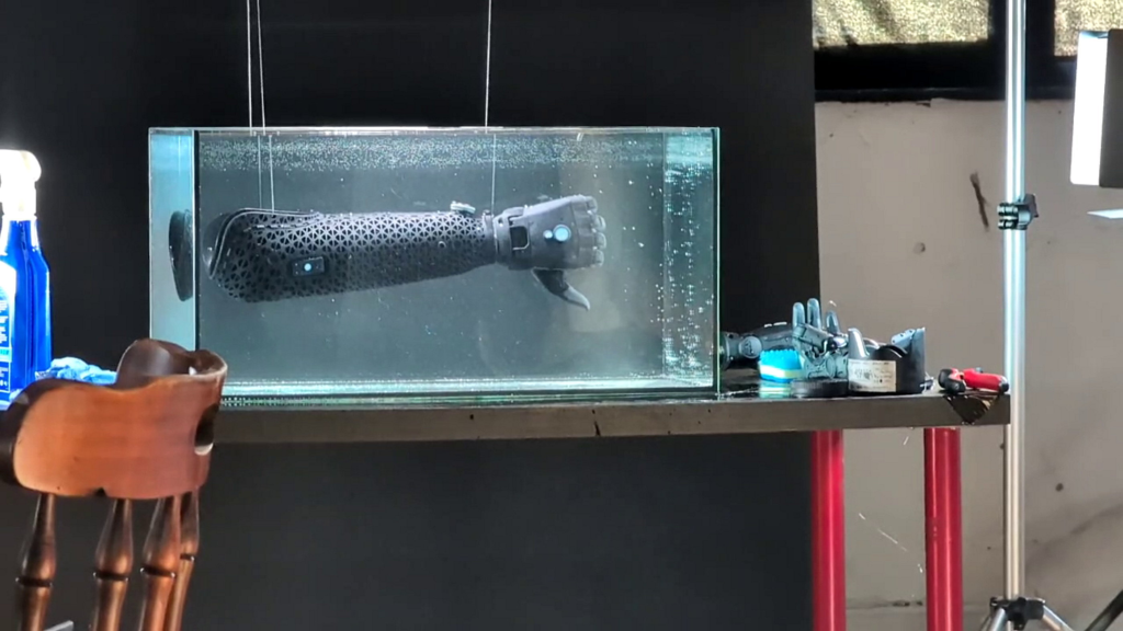 World’s first waterproof bionic arm submerged in water tank