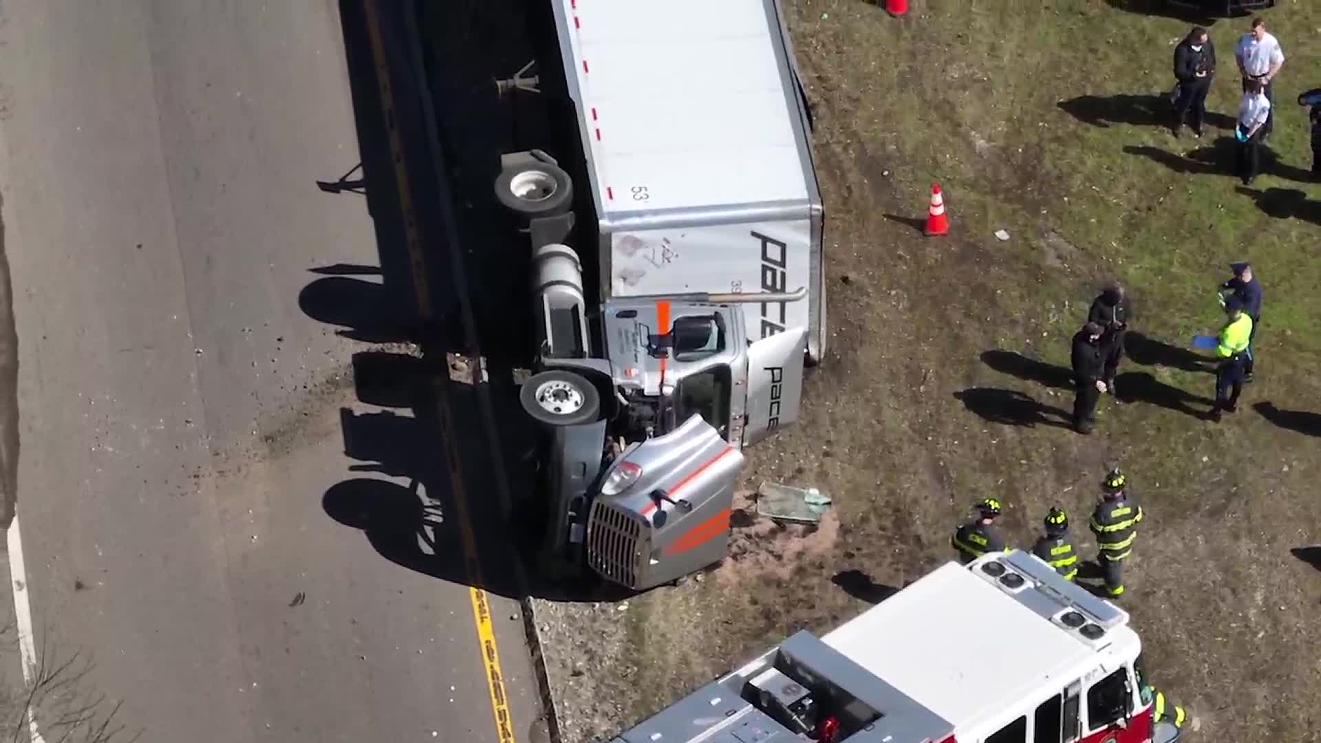 Bystanders rescue tractor-trailer driver from rollover crash in Dedham