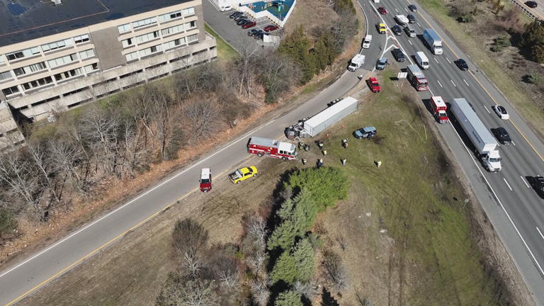 Bystanders rescue tractor-trailer driver from rollover crash in Dedham