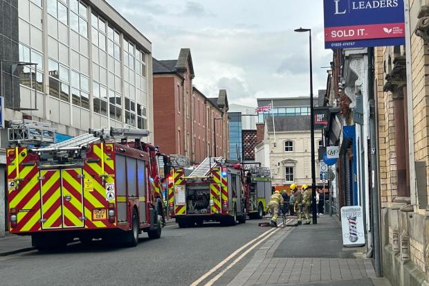 Four fire engines dispatched to town centre over fire in disused building