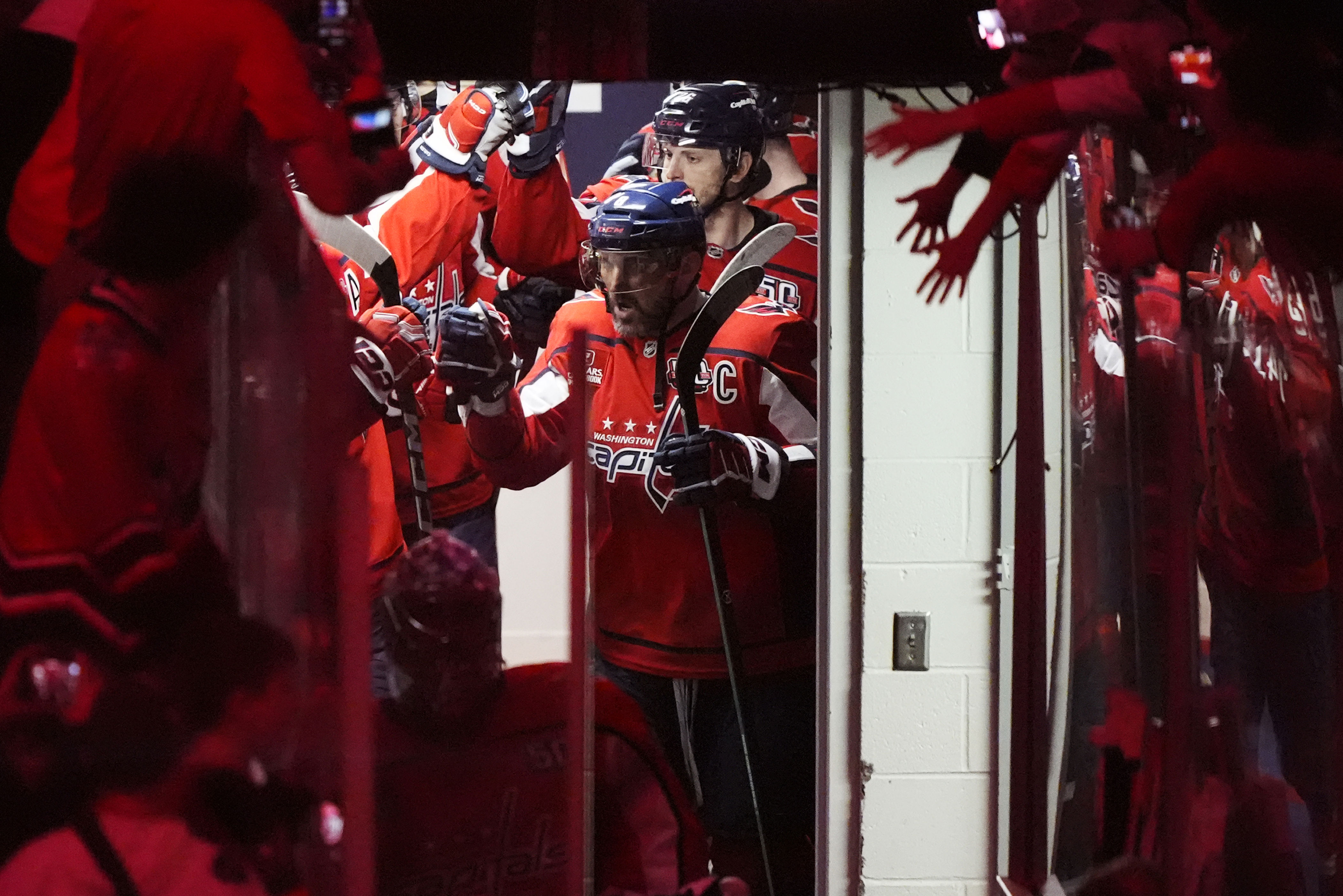 Inside the chaotic Caps’ pregame tunnel, featuring ‘Bandz’ and chicken parm