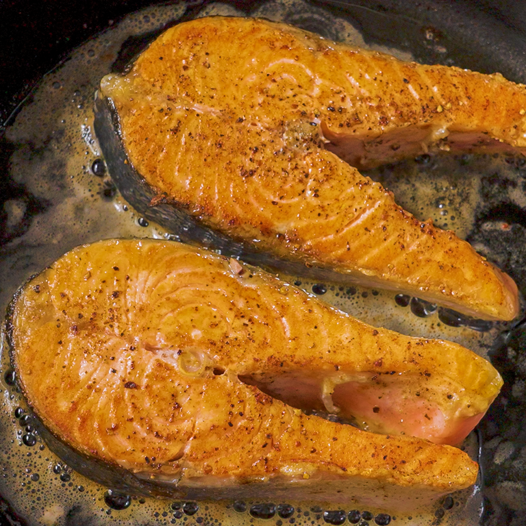Our Salmon Steaks Are Swimming In An Ocean Of Sweet & Buttery Sauce