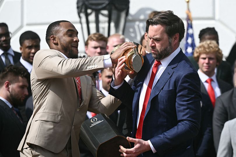 JD Vance drops National Championship trophy in front of Donald Trump ...