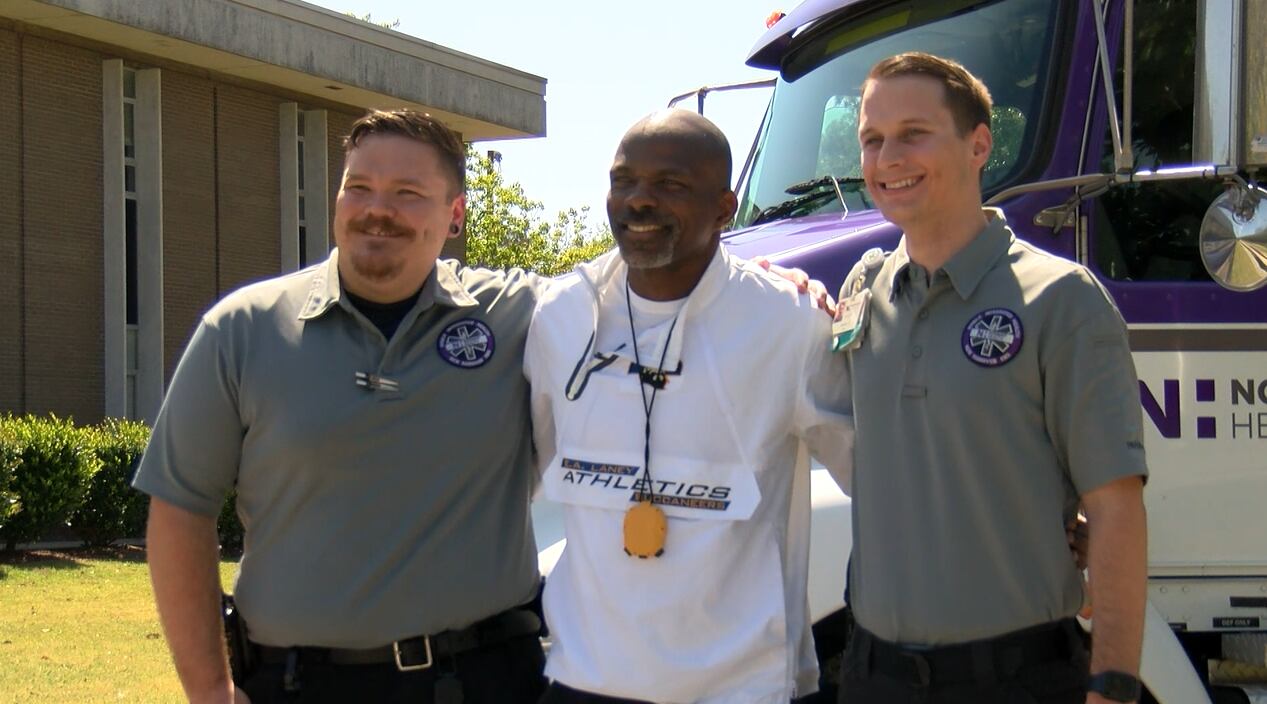 Laney High School coach reunites with EMTs who saved his life