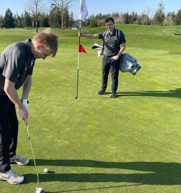 Wolverines golfers play at the difficult Loomis Trails Golf Club
