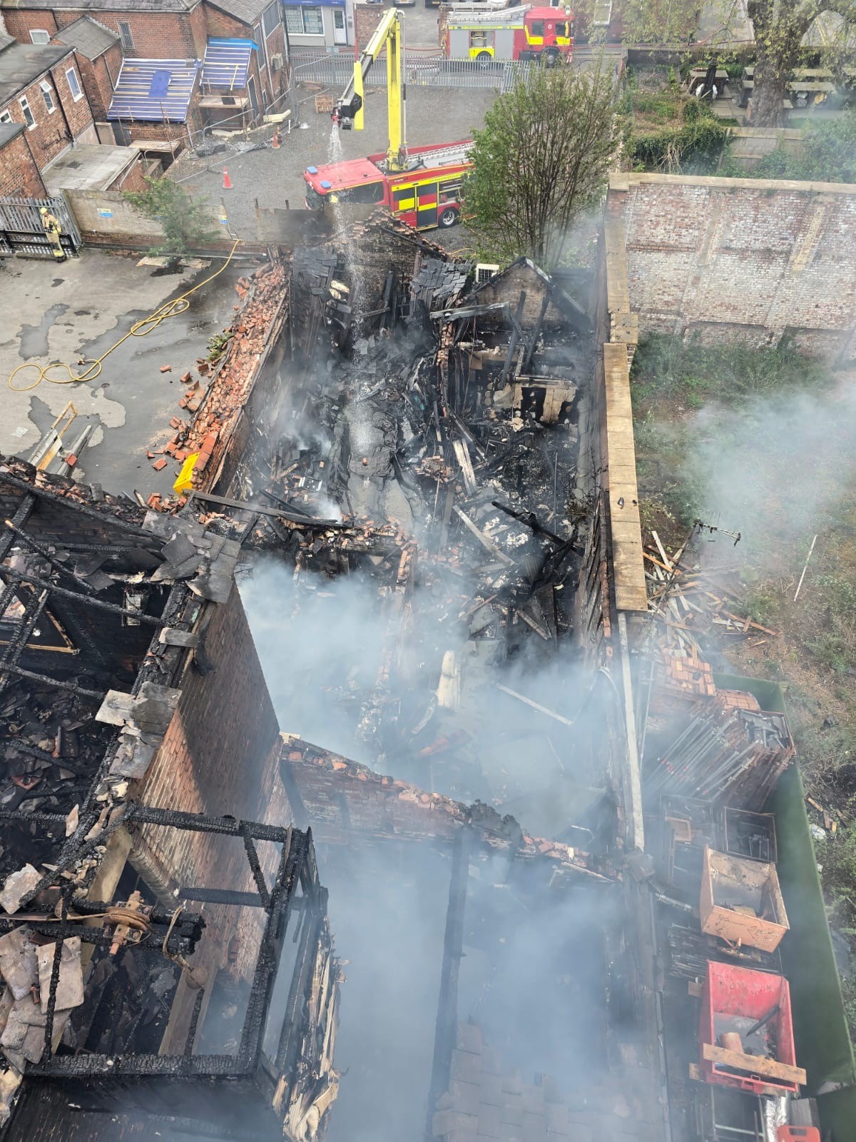 Firefighters remain on Barbauld Street in Warrington tackling huge ...