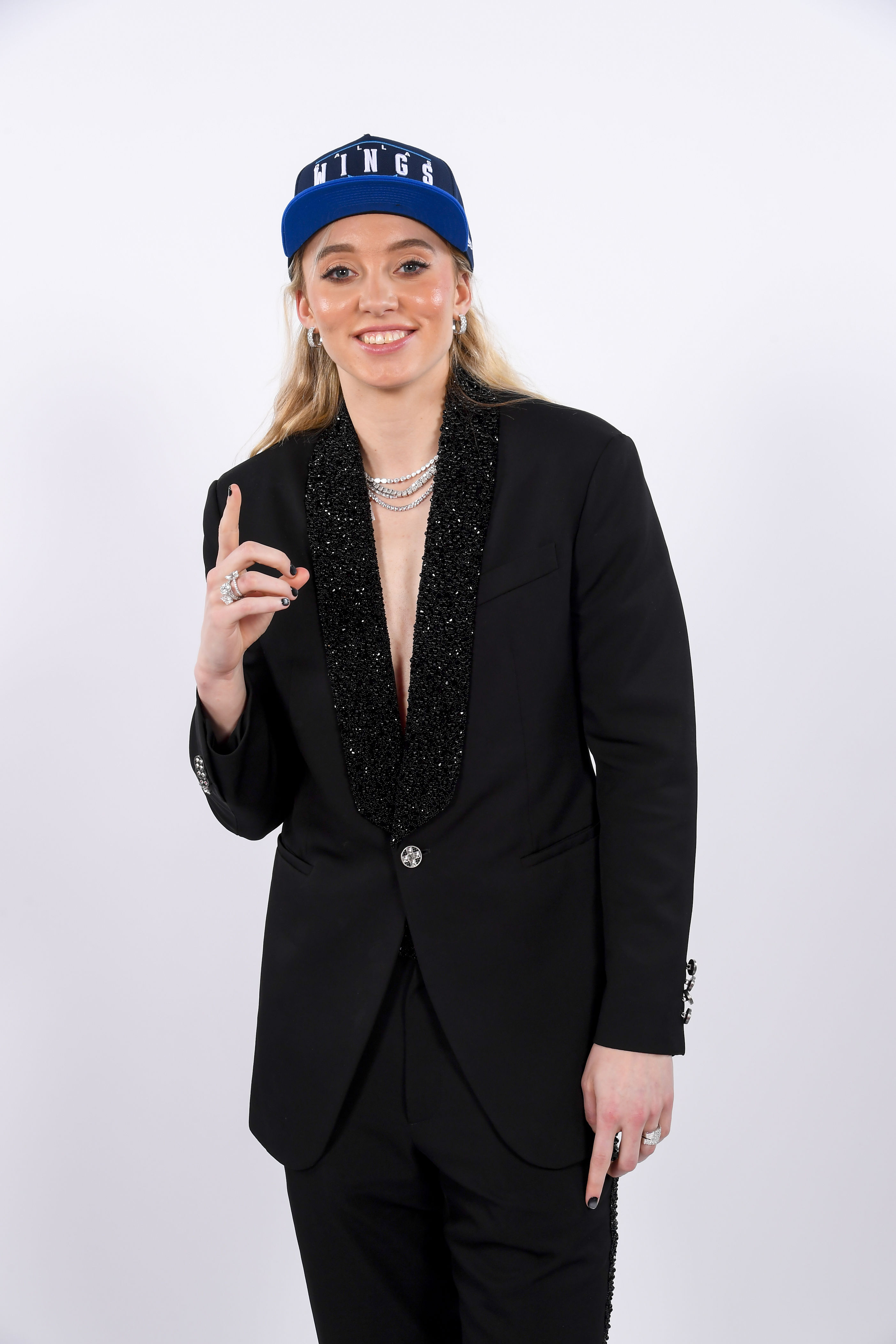 Paige Bueckers pulls double duty in pair of sparkly suits at WNBA 2025 ...