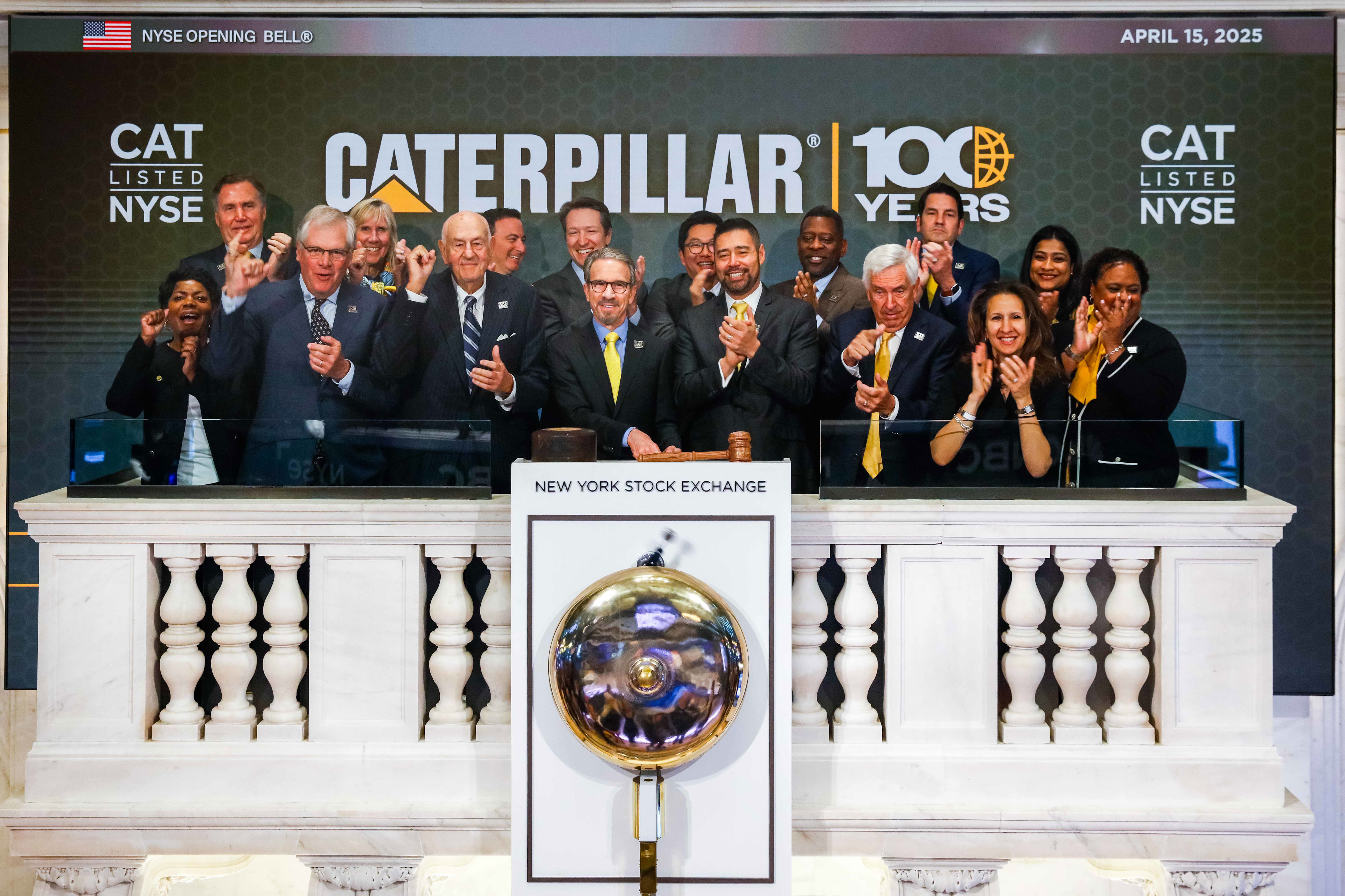 Caterpillar CEO rings bell at New York Stock Exchange on company's 100th anniversary