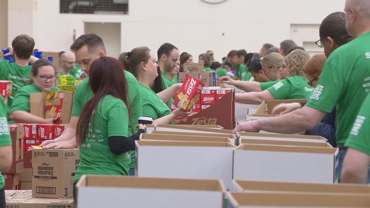 HELPING HANDS | Volunteers gather to pack 15,000 boxes for disaster relief