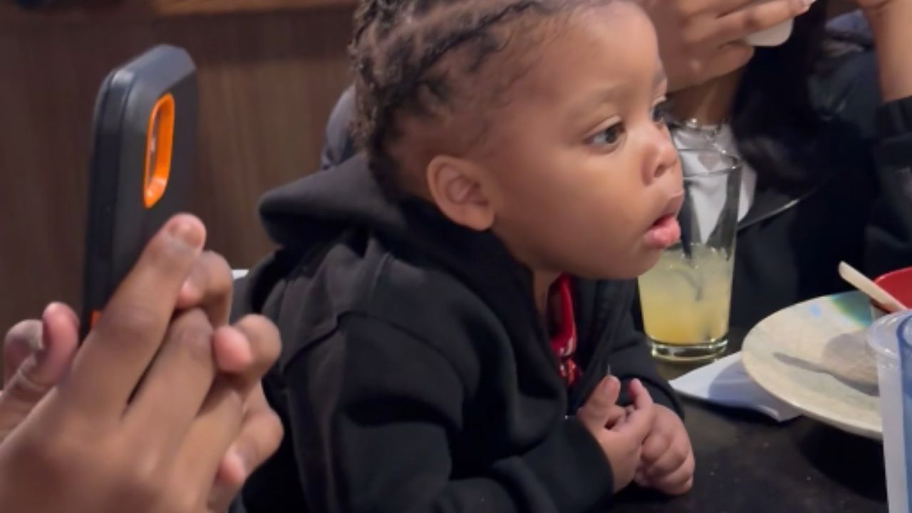 Little boy stares at hibachi tricks until fire makes him back away
