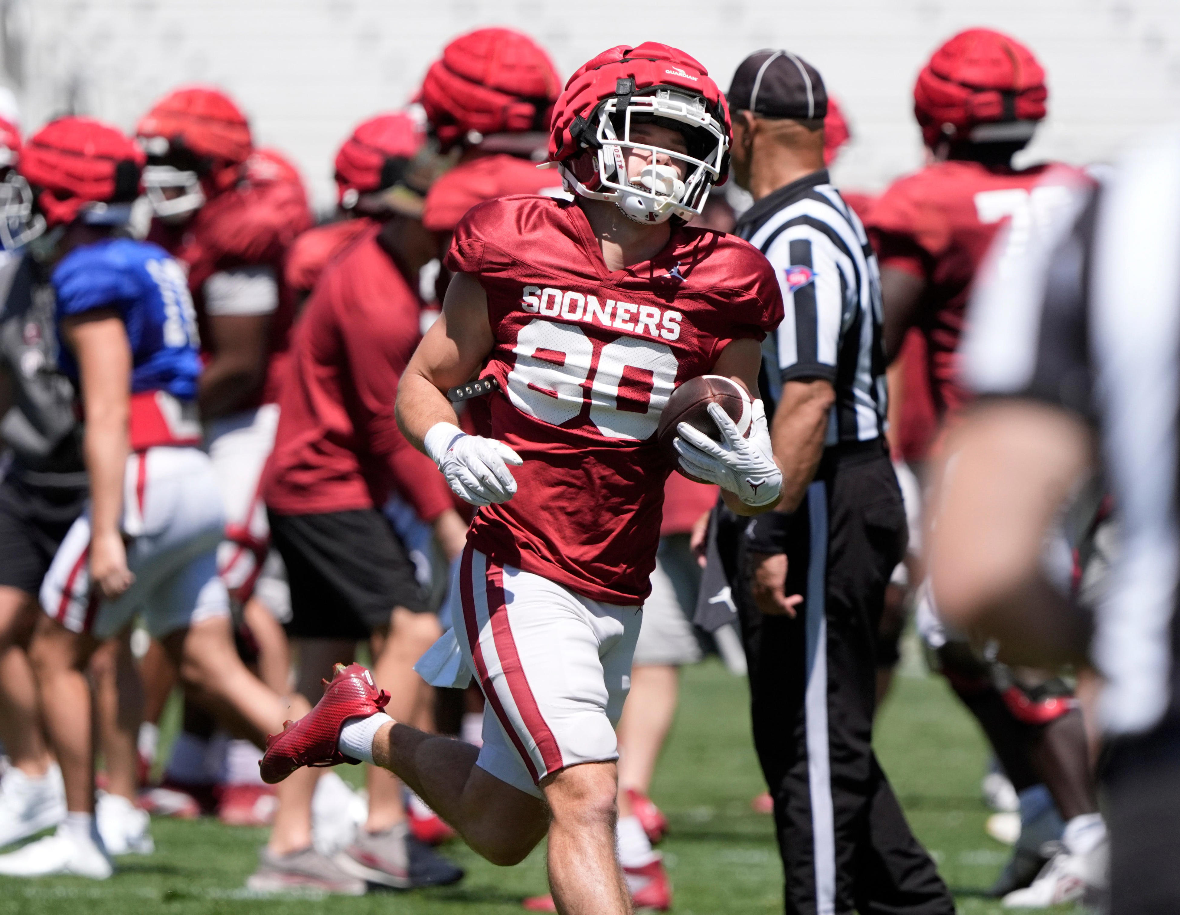 Baker, Emily Mayfield surprise Oklahoma Sooners walk-on WR with scholarship