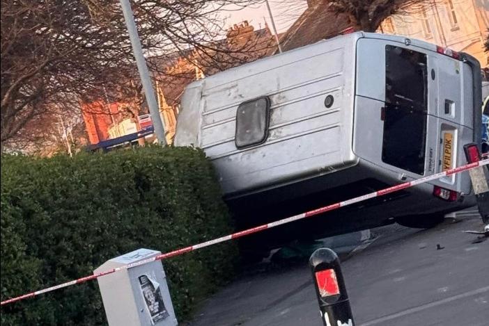 Van pictured on its side after Eastbourne collision