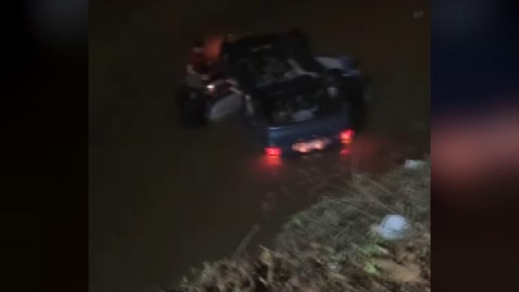 Strangers rescue couple after car drives over 20-foot cliff at ...