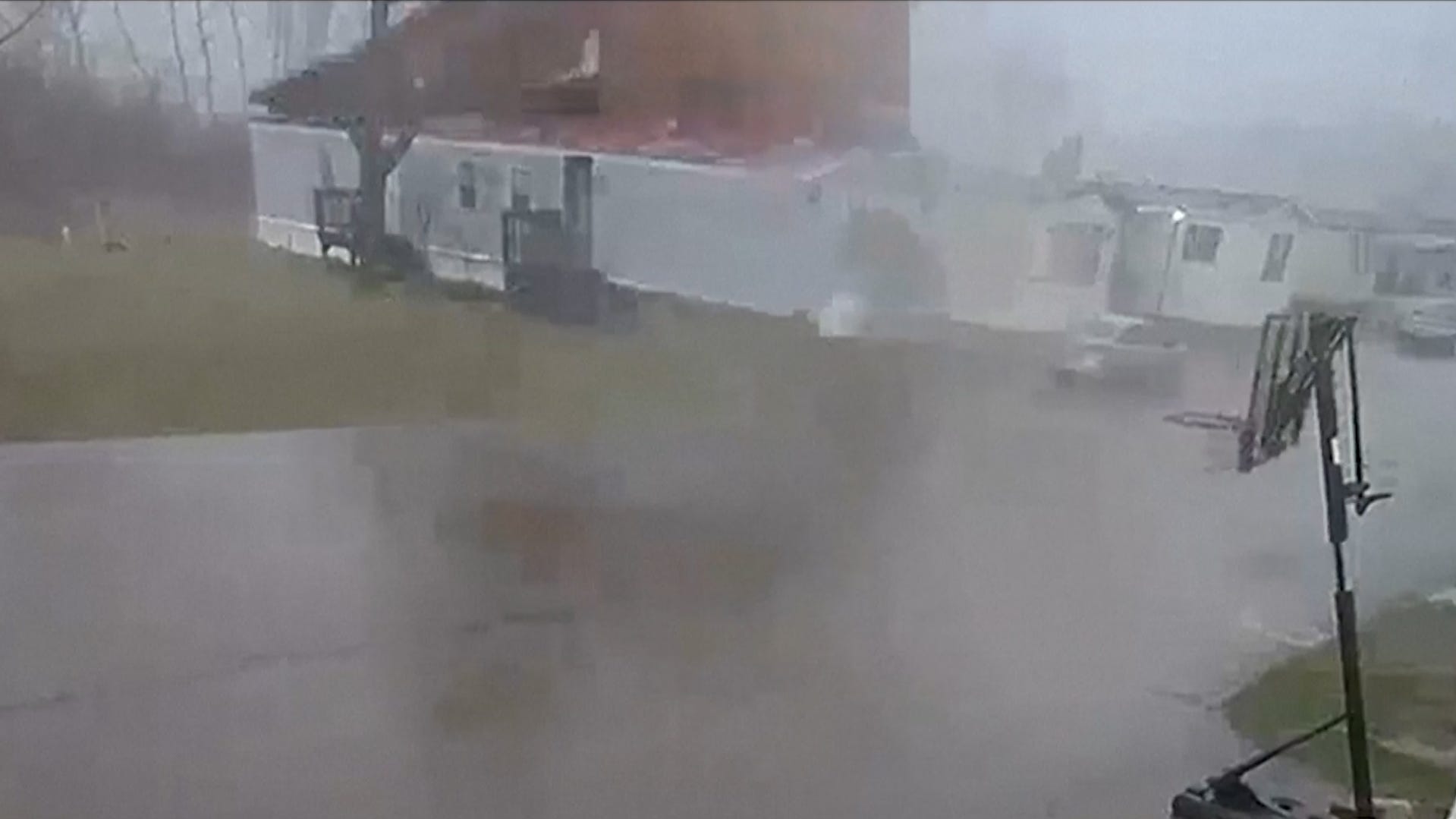 Heavy rain and wind tears roof off of a mobile home in Michigan