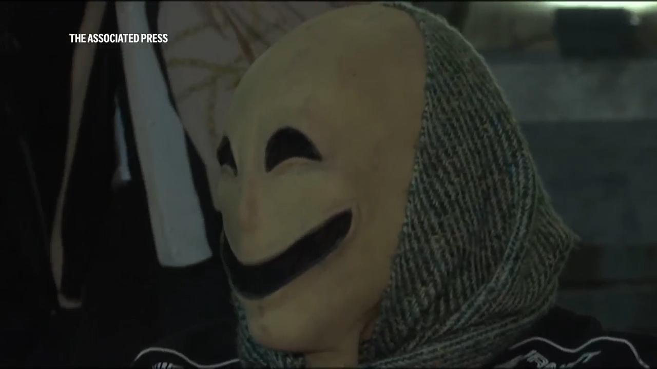 Protesters in Georgia get creative with face masks to defy government ...