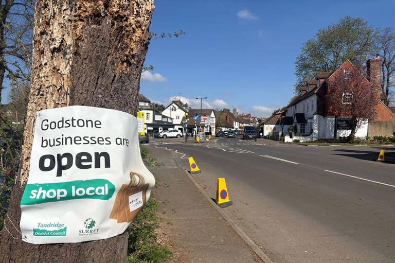 Life in the tiny Surrey village after a 65ft sinkhole tore through its ...