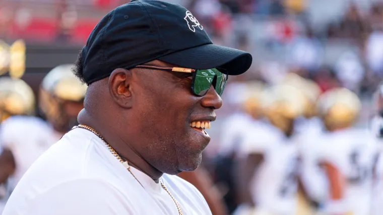 Colorado assistant football coach Warren Sapp and DC Robert Livingston ...