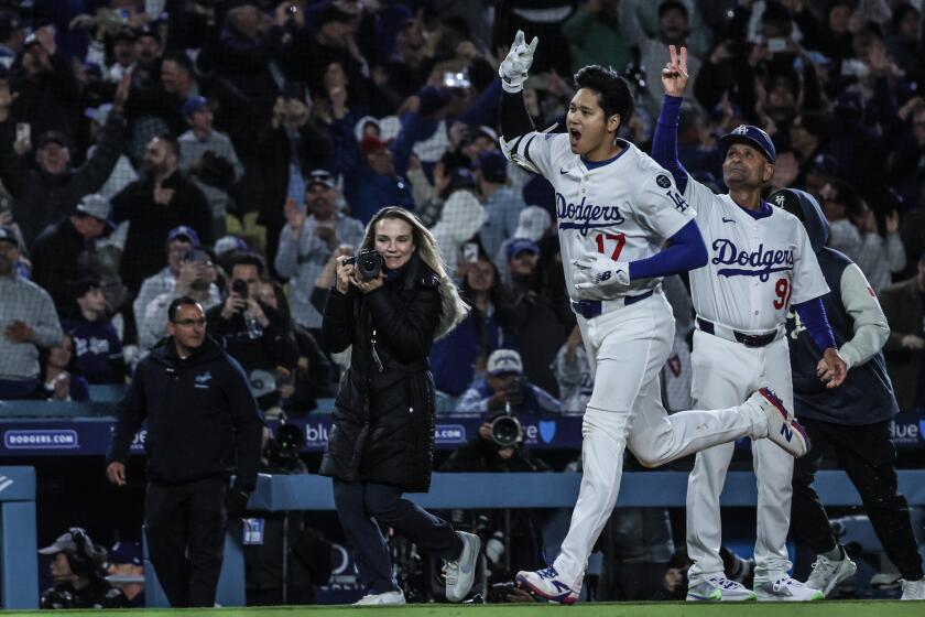 Plaschke: Who says the Dodgers can't go 162-0? Dramatic win over Braves ...