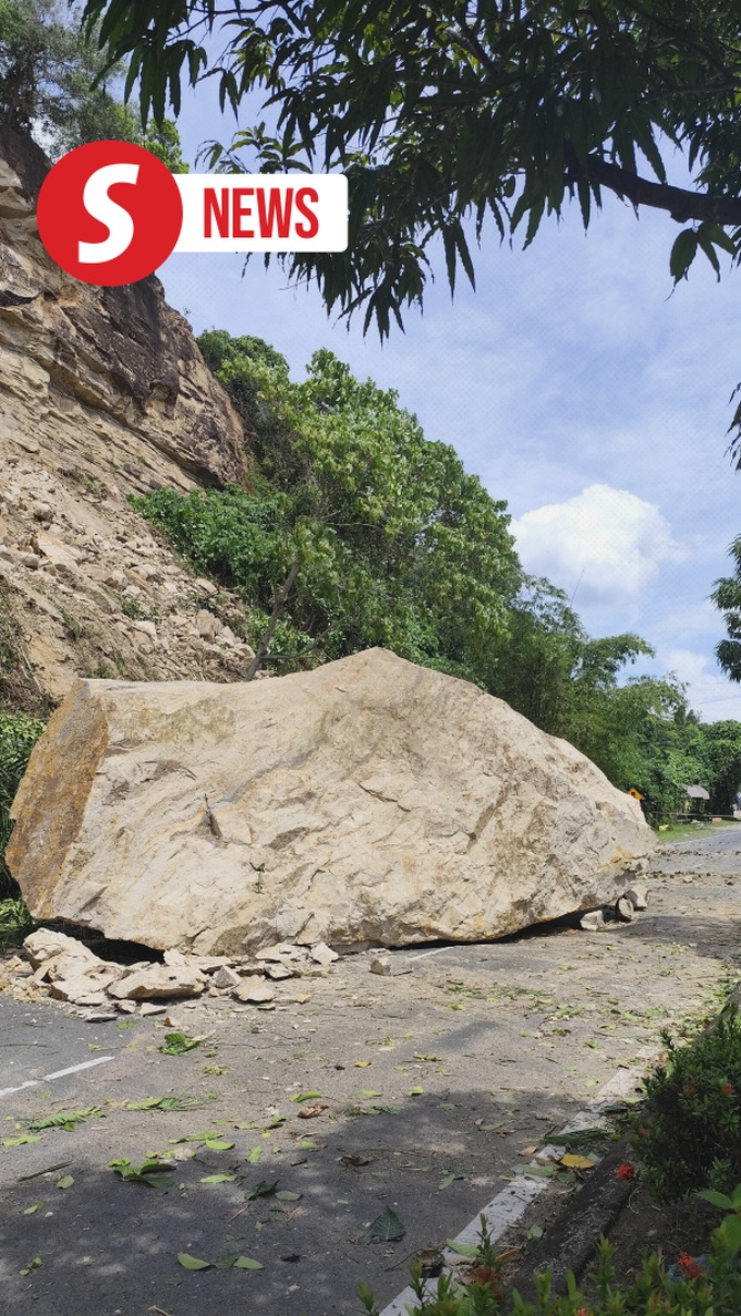 Sandakan village road blocked by massive boulder after landslide