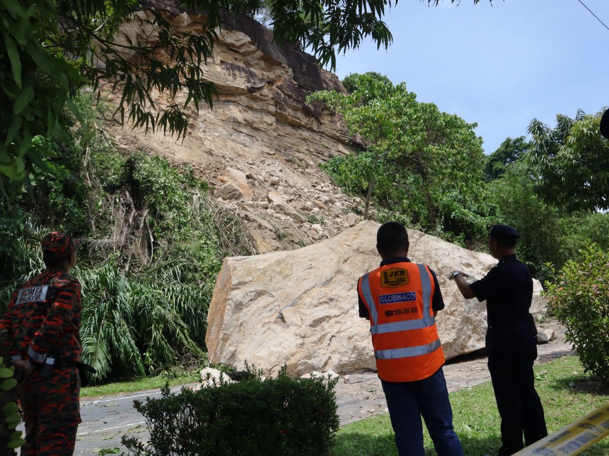 Sandakan village road blocked by massive boulder after landslide