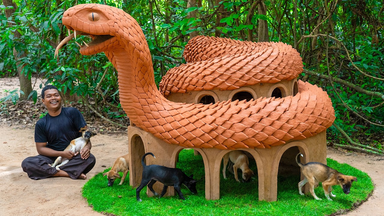 Adorable Puppies Protected in a Snake Shaped Mud House Built by Hand