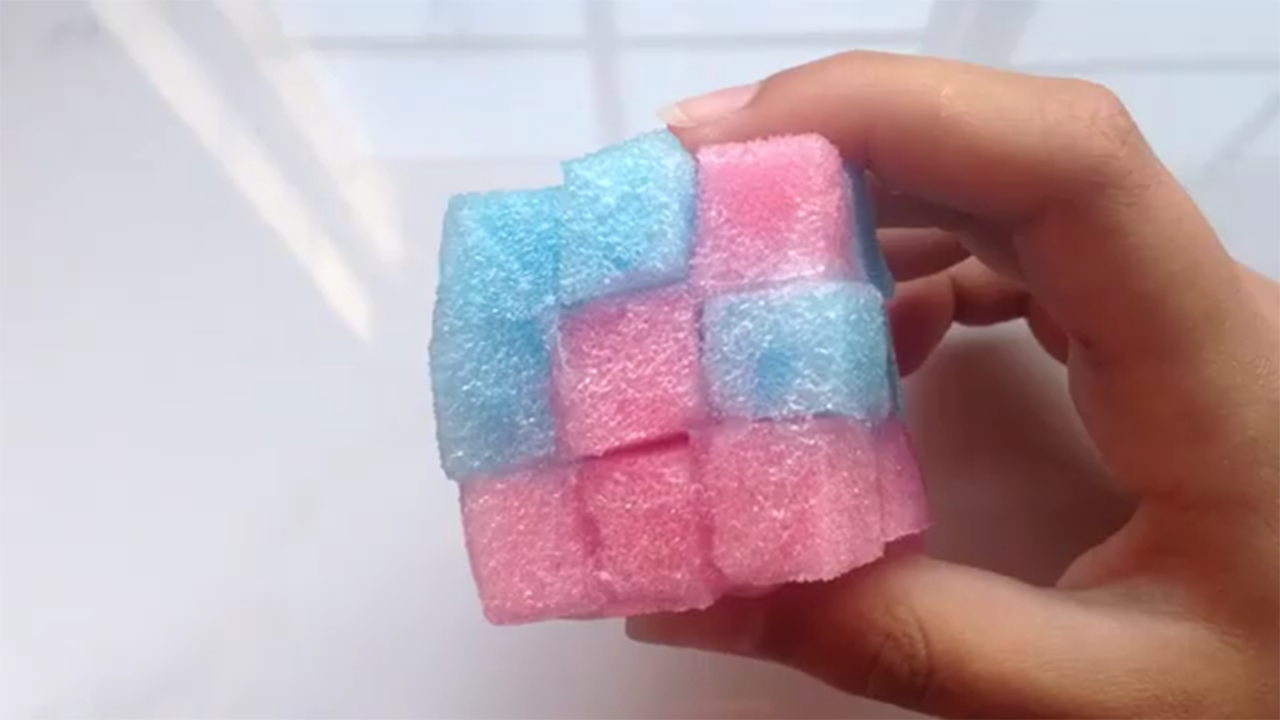 Satisfying Squeezing A Blue And Pink Foam Cubes