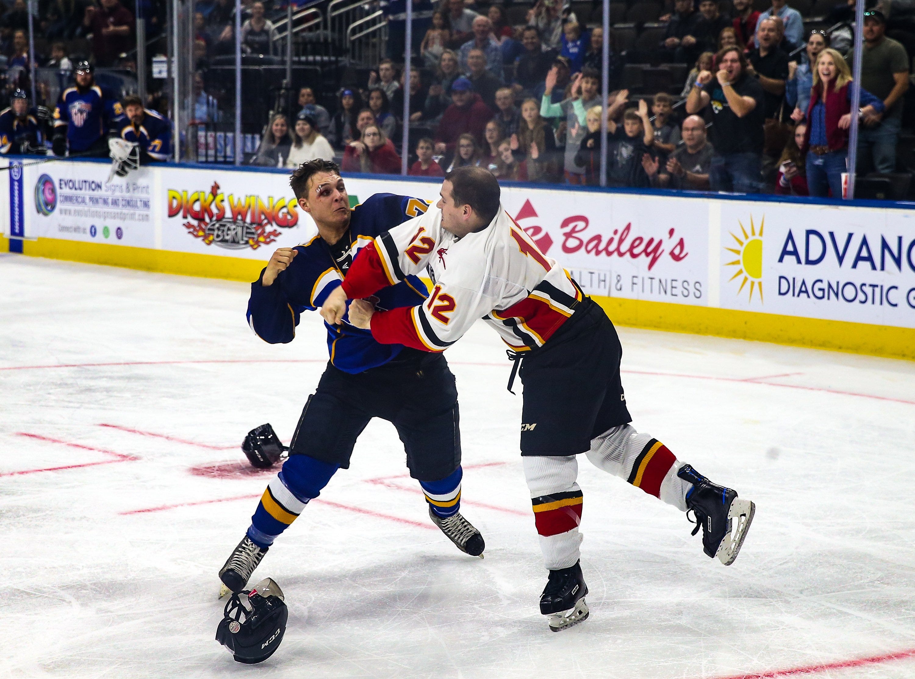 Cops and firefighters stick it out on the hockey rink for Guns 'N Hoses