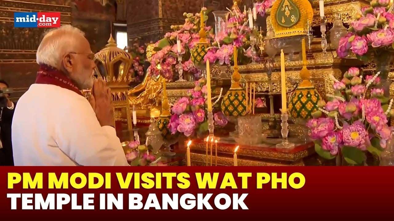 PM Modi in Bangkok lights candle at famous Wat Pho temple, takes ...