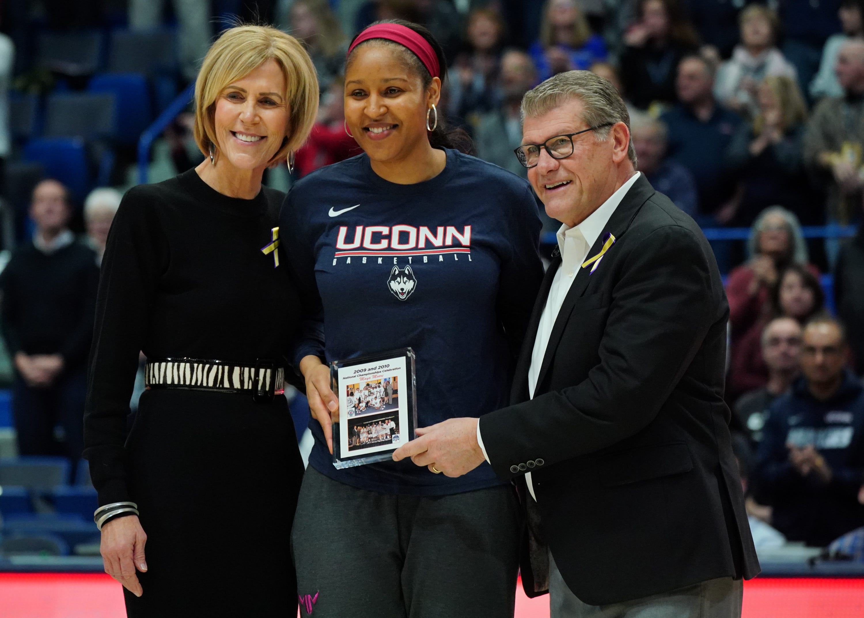 UConn's Geno Auriemma and UCLA's John Wooden stand at the top of the ...