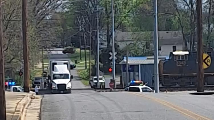 18-wheeler gets stuck on tracks, halting train in Hartselle