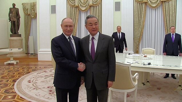 Putin meets Chinese FM Wang as he 'expects' to see Xi Jinping soon