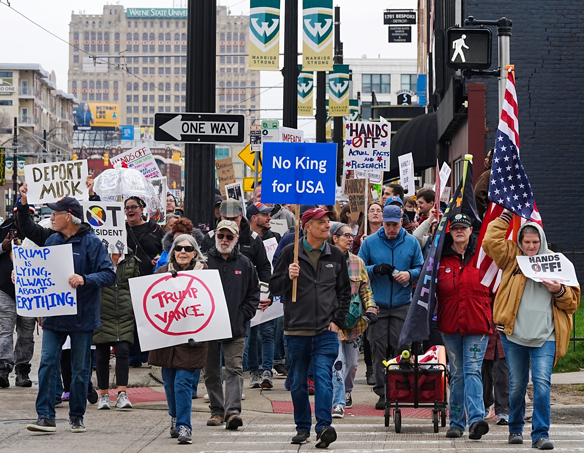 Thousands protest Trump, Musk across Michigan