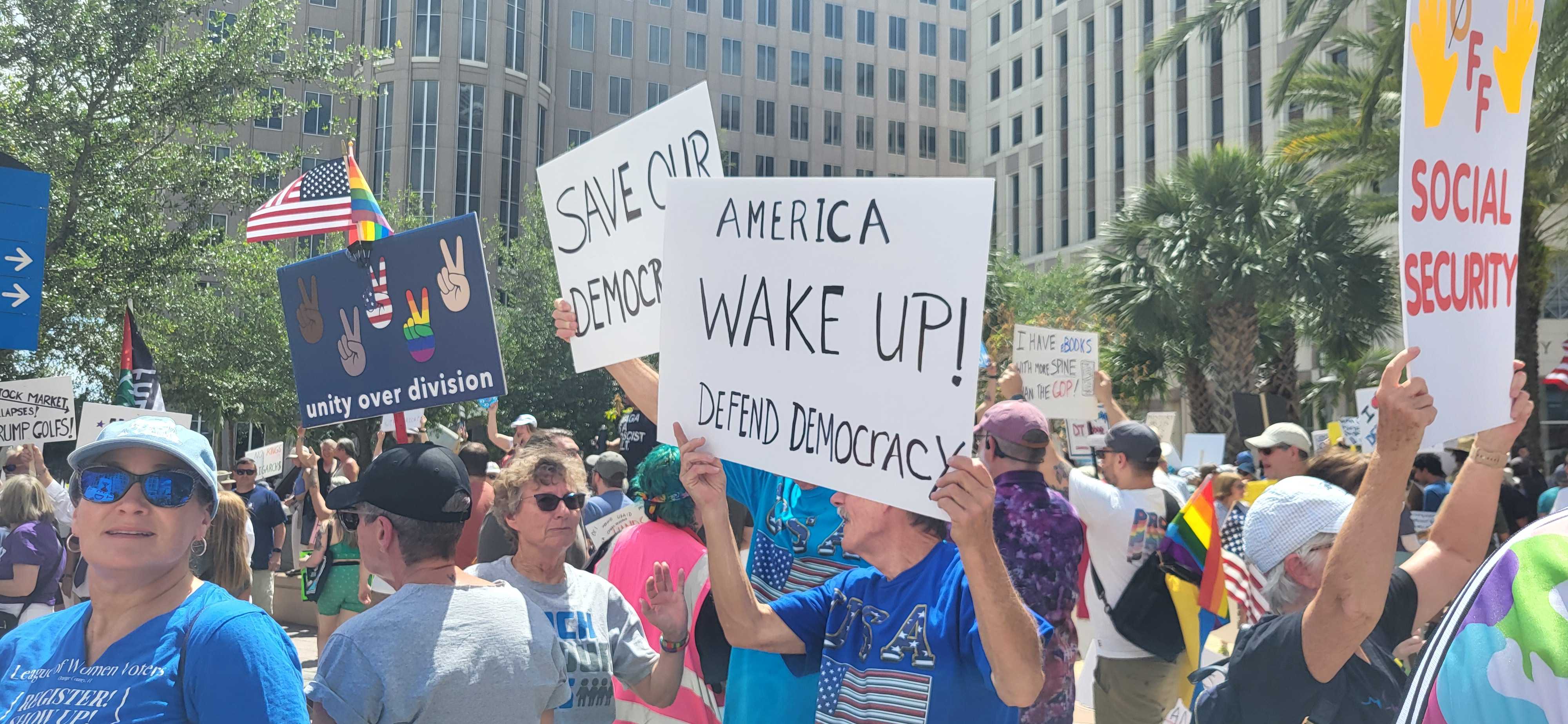 Protestors gather in Central Florida opposing actions of Trump and Musk