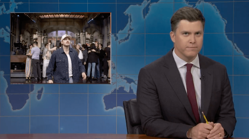 Colin Jost Continues ‘SNL' Roast Of Morgan Wallen: "Money Is Leaving ...