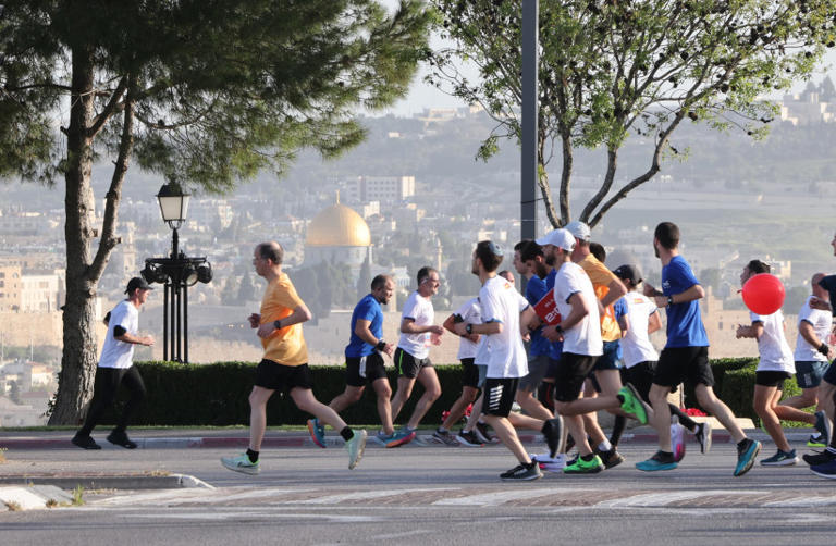 Tens of thousands run in record-breaking Jerusalem Marathon