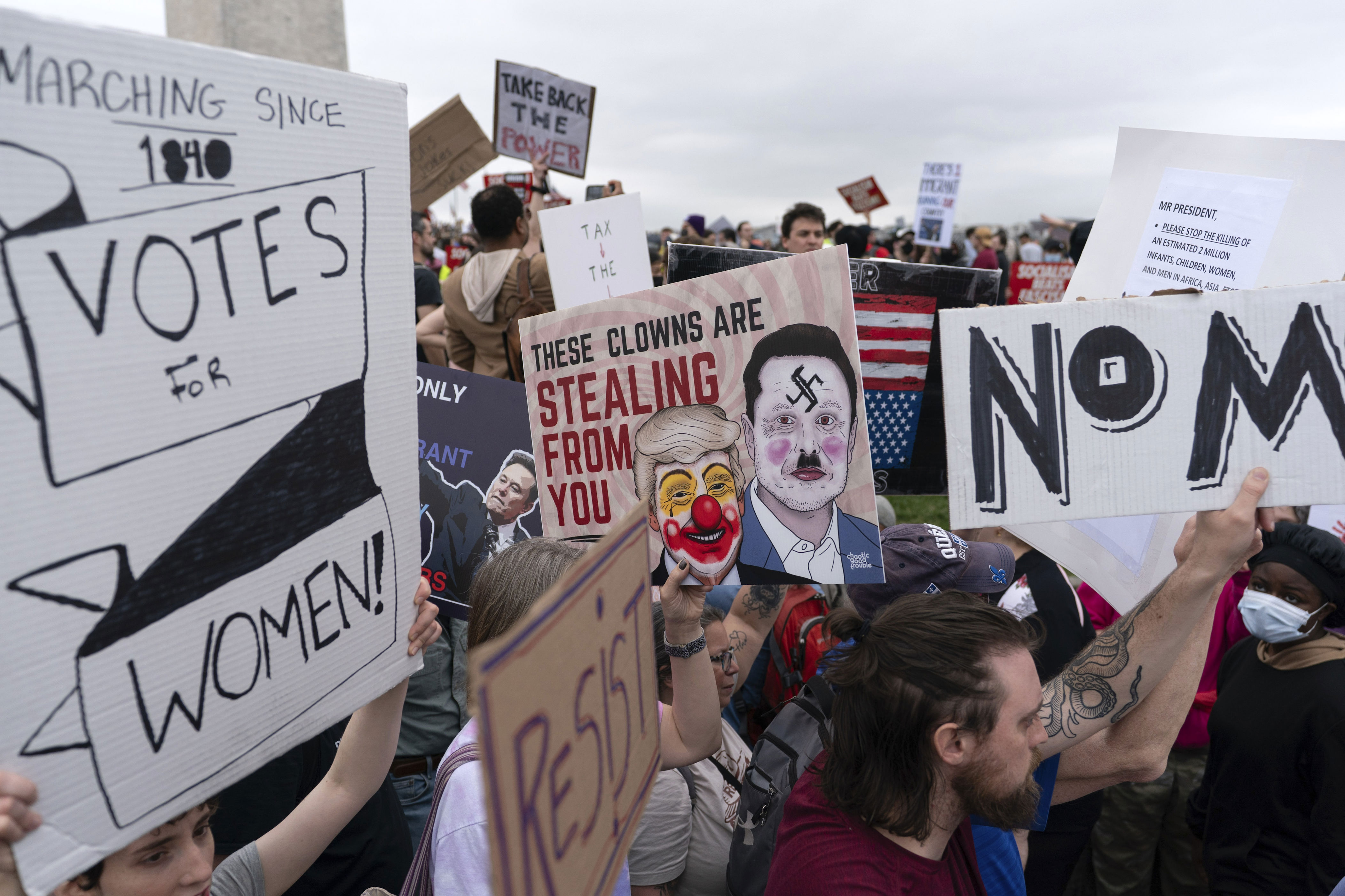 Tax rich, not penguins: Sassy signs at 'Hands Off' protests mock Trump ...