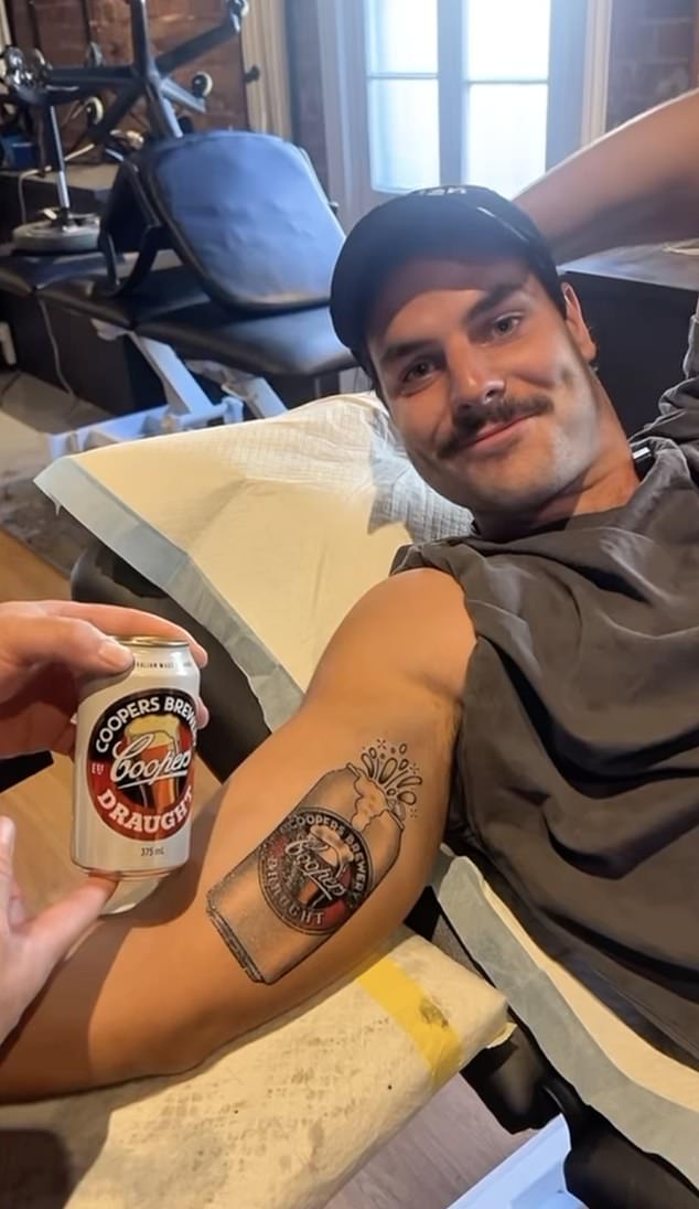 Footy star stuns fans by getting a can of BEER inked on his arm as his ...