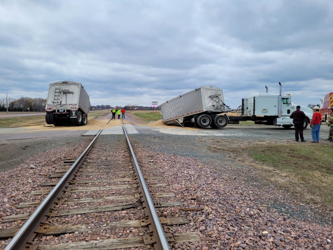 Video: Semi driver narrowly escapes as train splits trailer in half