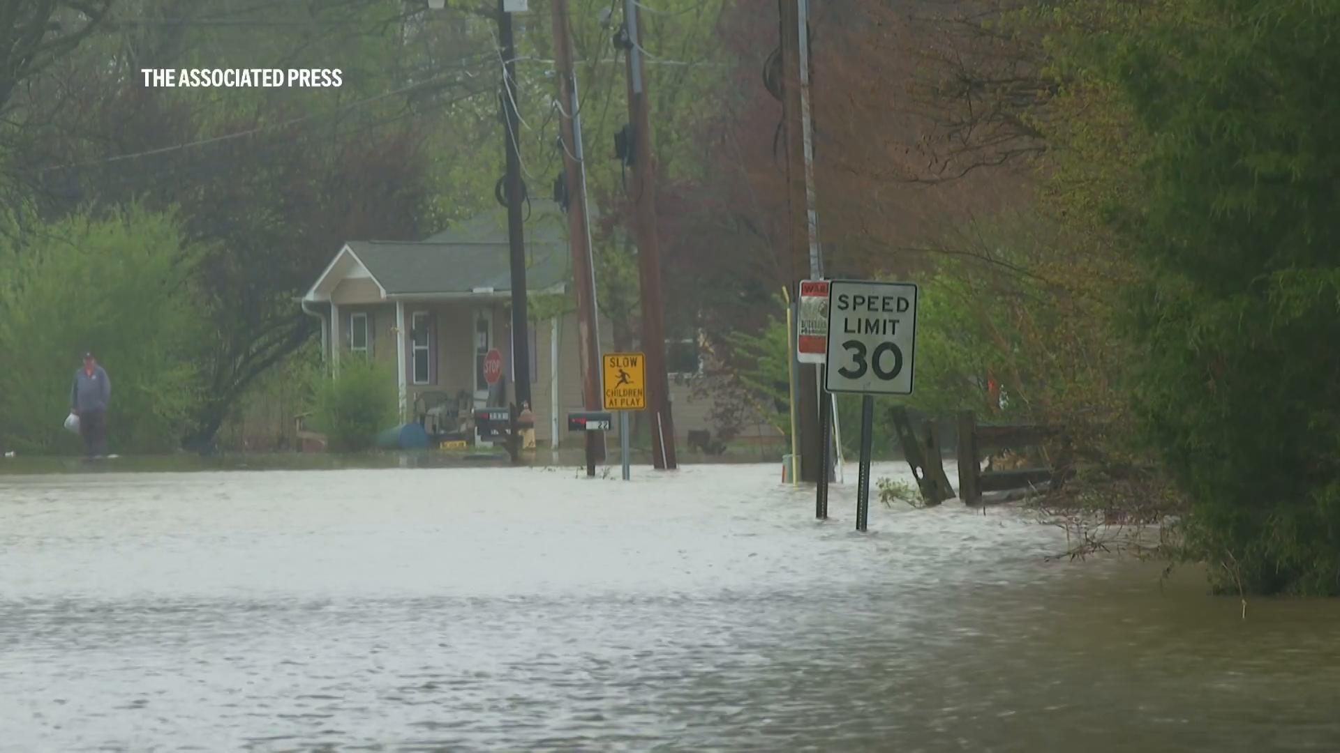 Residents of a Tennessee town evacuated, leaving behind flooded homes