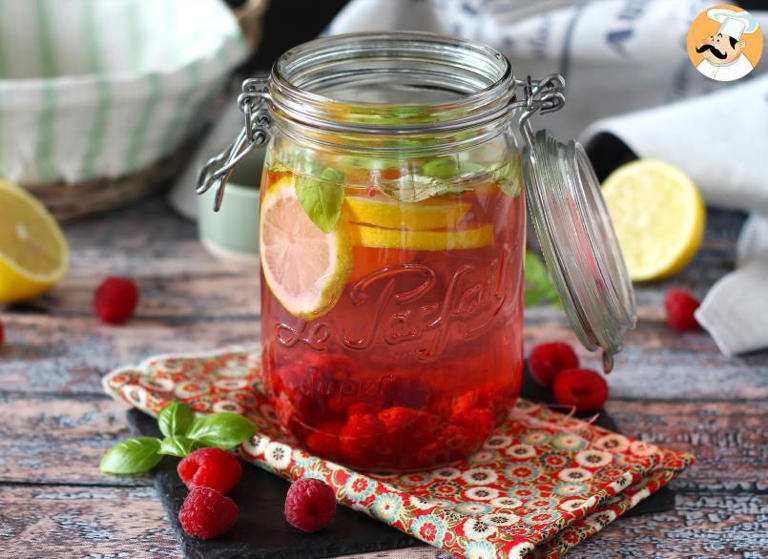 Homemade flavored water with lemon, basil and raspberry