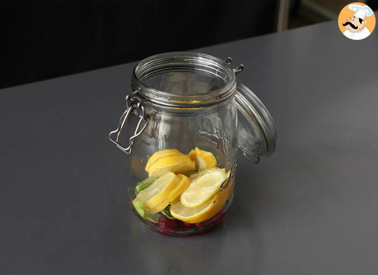 Homemade flavored water with lemon, basil and raspberry