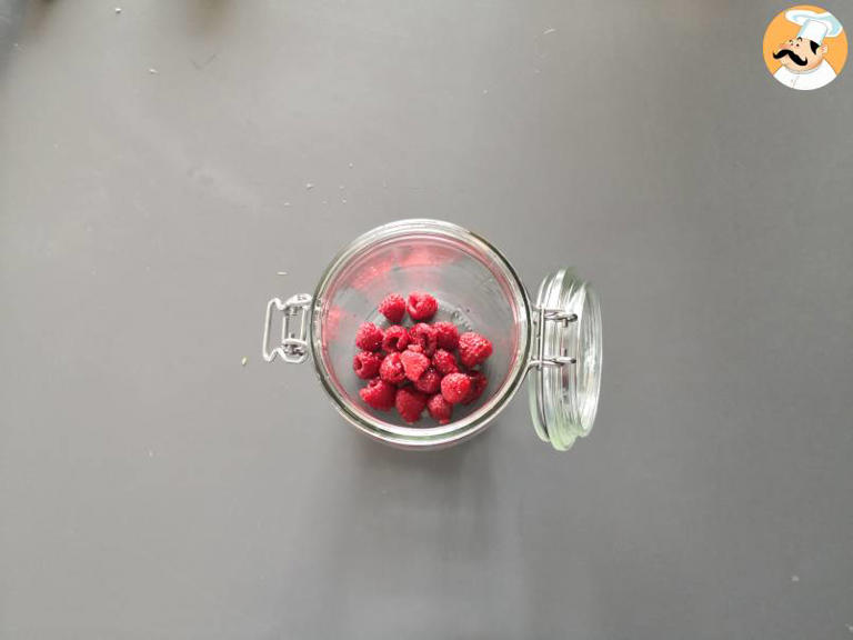 Homemade flavored water with lemon, basil and raspberry